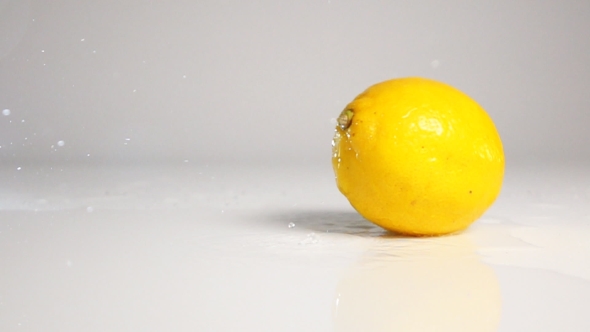 Lemon Fall Down On White Surface, Stock Footage | VideoHive