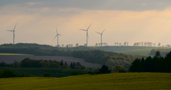 Beautiful Windmill Turbines, Wind Energy Silhouetted In The Sunset ...