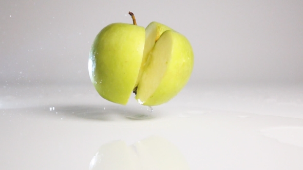 Apple Break On Two Halves On White Surface, Stock Footage | VideoHive