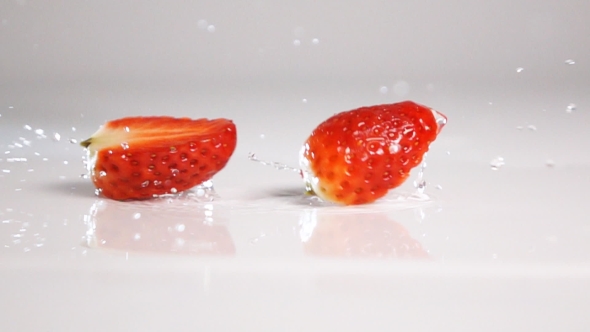 Sliced Strawberry Drop On White Surface, Stock Footage | VideoHive