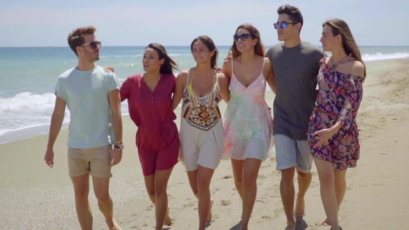 Happy Group Of Young Students Walking On a Beach, Stock Footage | VideoHive