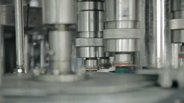 Rotating Machines Are Moving Bottles And Pouring Water, Stock Footage