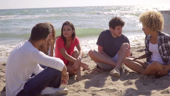 Group Of Diverse Young Friends Chatting On a Beach, Stock Footage ...