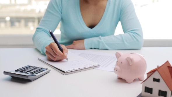 Woman Counting On Calculator And Taking Notes 64, Stock Footage | VideoHive