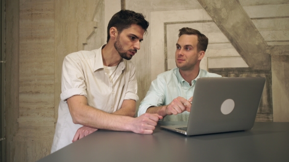 Two Men Friends Looking On The Computer And Laughing. , Stock Footage