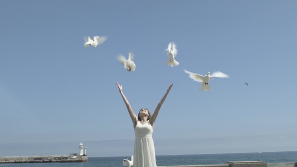 Cheerful Girl Releasing A White Doves, Stock Footage | VideoHive