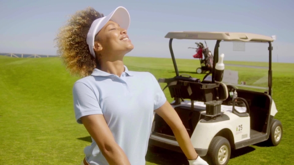 Attractive Female Golfer With a Golf Cart, Stock Footage | VideoHive