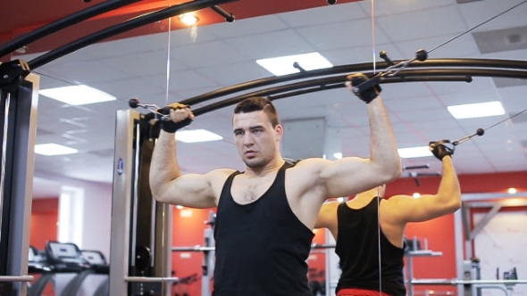 Man Do Exercise For Biceps With Cable Crossover Machine, Stock Footage
