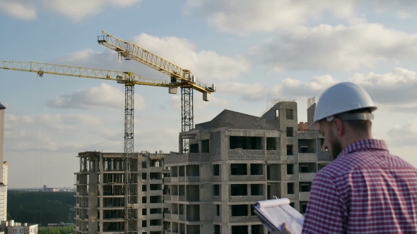 Engineer Looking On Project On Construction Site, Stock Footage | VideoHive
