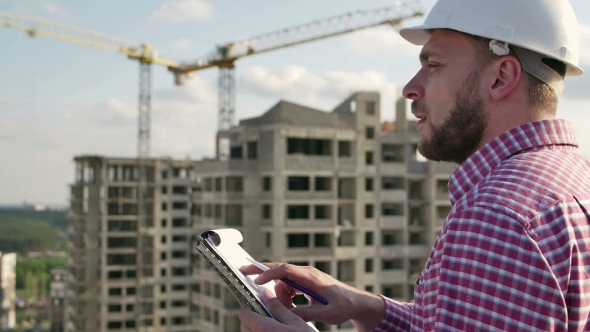 Engineer Looking on Project on Construction Site, Stock Footage | VideoHive