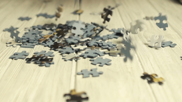 Puzzle Parts Falling On White Table, Stock Footage | VideoHive