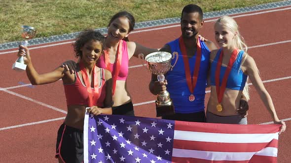 Multiracial Sport Team From Usa Showing Cups and Trophies, Competition ...
