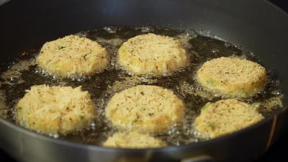 Close Up Shot of Cheese Snacks Fried Rotating in a Frying Pan, Stock ...