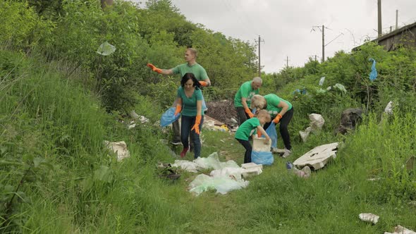 Volunteer Team Cleaning Up Dirty Park From Plastic Bags, Bottles ...