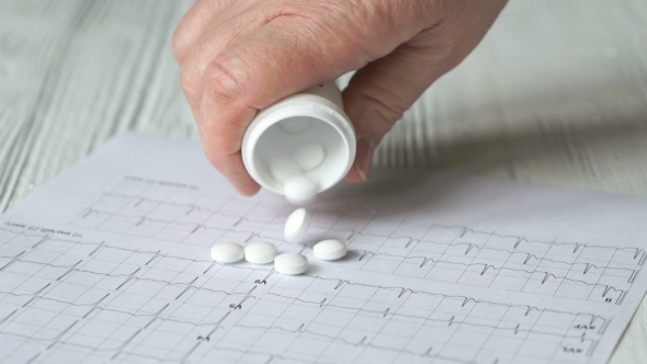 Hand Pours Out Tablets From The Bottle On a Table, Stock Footage ...