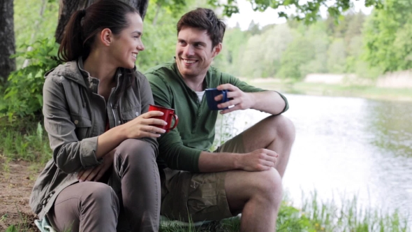 Happy Couple With Cups Drinking Tea In Nature 7, Stock Footage | VideoHive