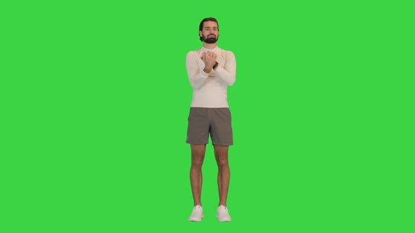 Man Stretching Forearm Before Exercising on a Green Screen Chroma Key ...