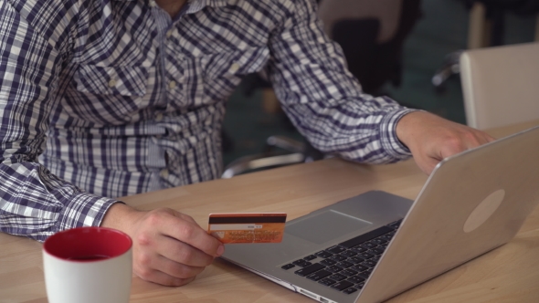 Online Banking Detail. Man Buying Via Internet Using Credit Card And ...