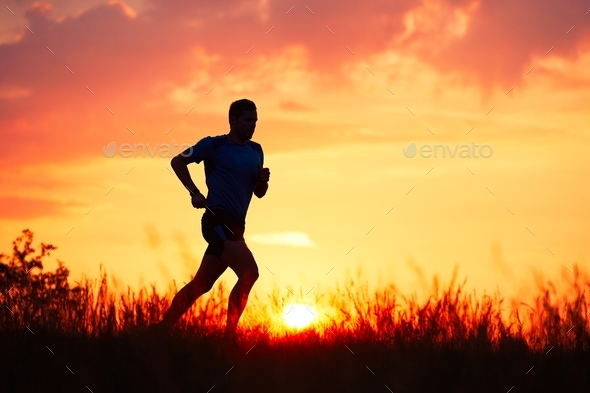 Athletic runner at the sunset Stock Photo by Chalabala | PhotoDune