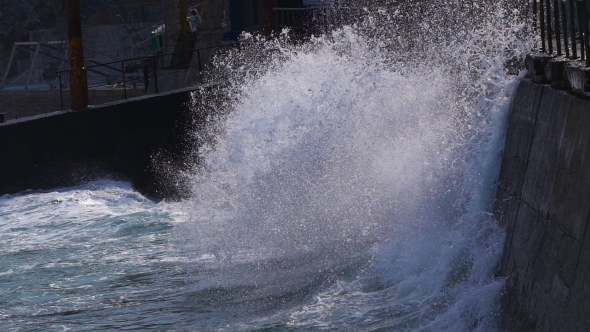 Strong Waves Breaking On The Stone Slabs Waterfront., Stock Footage