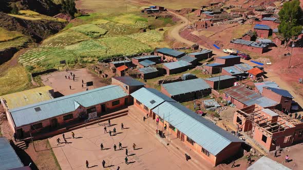People playing soccer in a traditional Inka farming village in the ...