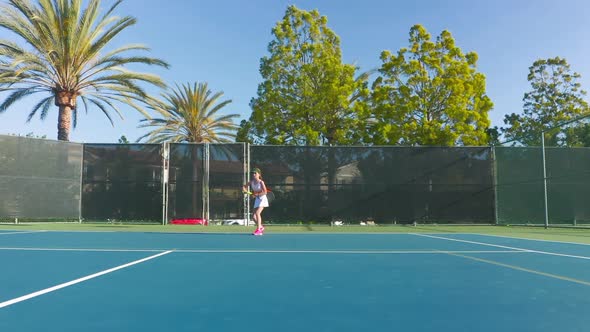 Slow-motion of a Young Athlete Running at a Tennis Court and Hitting ...