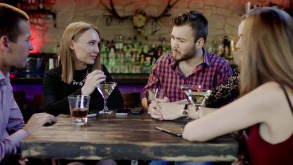Company Of Young People Is Chatting And Smiling In The Bar, Stock Footage