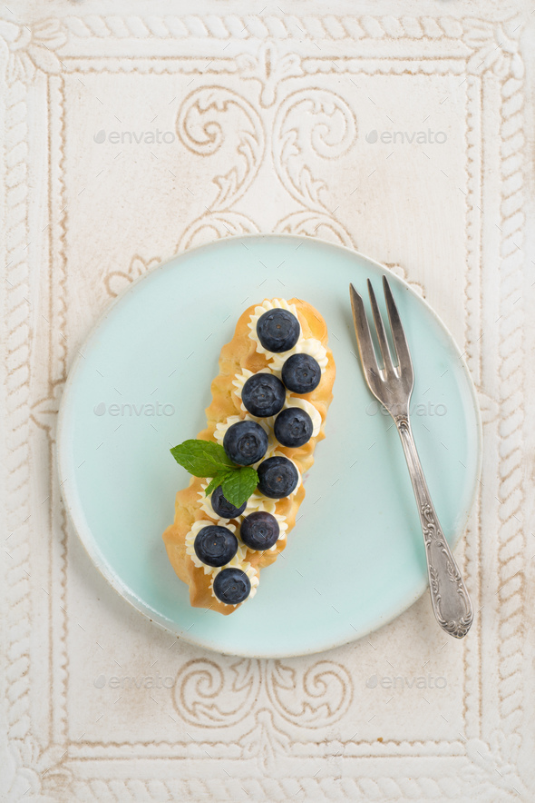Buttercreme blueberry eclair Stock Photo by ECoelfen | PhotoDune