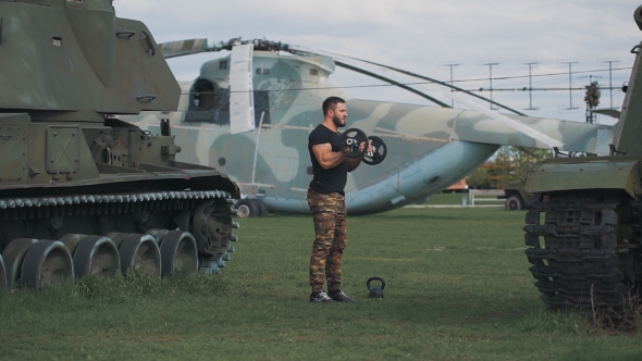 Muscular Man In a Military Uniform Has Arranged Training At a Military ...