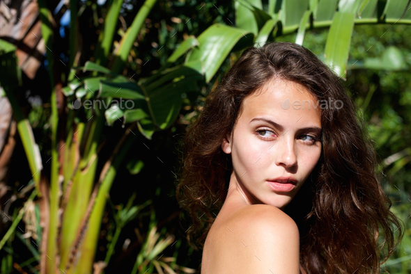 Beautiful female fashion model looking over shoulder Stock Photo by ...