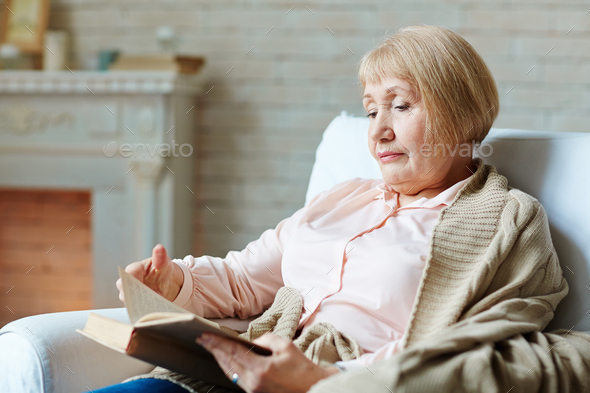Senior reader Stock Photo by Pressmaster | PhotoDune