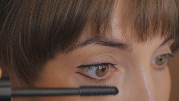 Pretty Girl Paints Her Eyelashes, Stock Footage | VideoHive