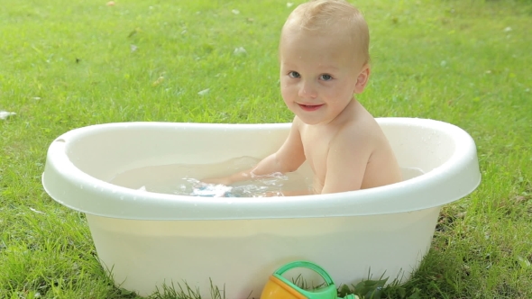 Baby Has Fun Bathing Outdoor, Stock Footage | VideoHive