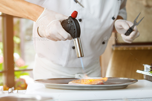 Man's hand with torch burner Stock Photo by stockfilmstudio | PhotoDune