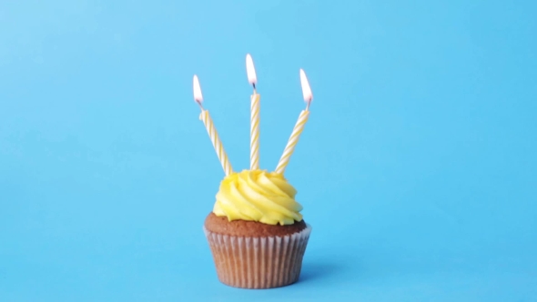 Birthday Cupcake With Three Burning Candles, Stock Footage | VideoHive