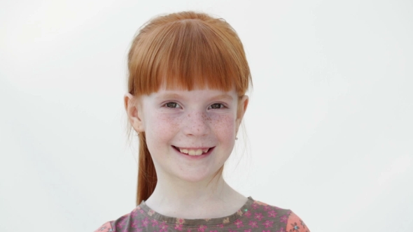 Happy Little Ginger Girl with Freckles Wink and Smiling, Stock Footage