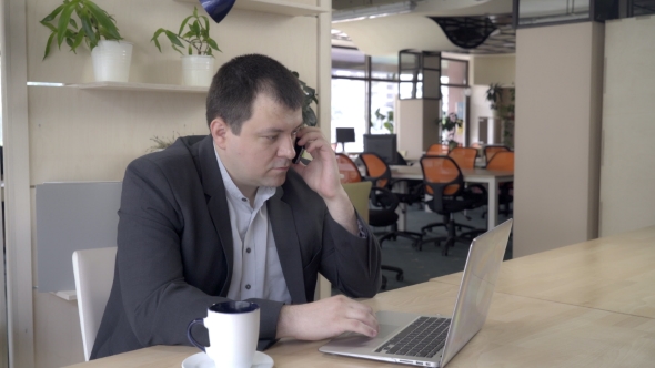 Boss In Empty Office Works With Modern Device., Stock Footage | VideoHive