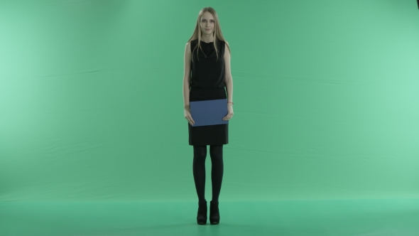 Girl Holding a Blue Screen On a Green Background, Stock Footage | VideoHive