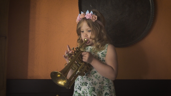 A Little Cute Girl Is Playing Saxophone In a Cozy Cafe, Stock Footage