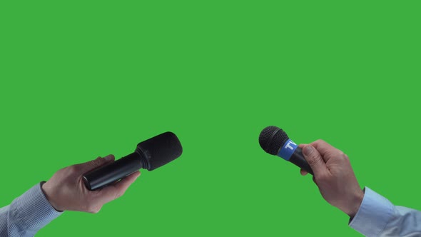 Two reporter holding mic, waiting for interview,green screen background ...