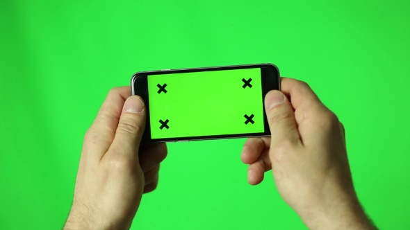 Smartphone With Green Screen Male Hands Detail Playing A Game In ...