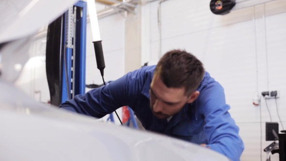 Mechanic Man Repairing Car At Workshop 21, Stock Footage | VideoHive