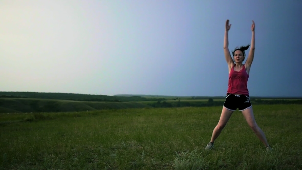 Athlete Warming Up Doing Jumping Exercises Running On a Sunset ...