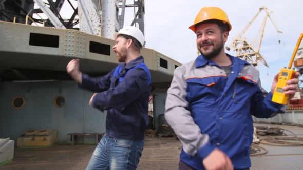 Funny Dancing Dock Worker And Engineer In Shipping Cargo Port, Stock ...