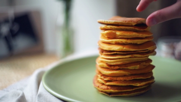 Dessert For Morning Breakfast. Man Takes Pancake From Pancake Stack ...