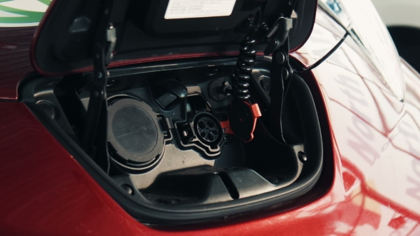 Red Electric Car On The Charging Point by FrameStock | VideoHive
