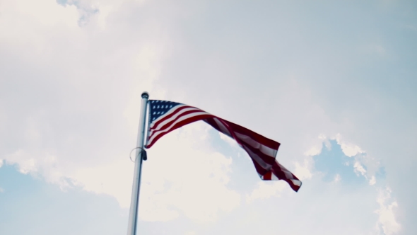 United States Flag Flying From a Flagpole, Stock Footage | VideoHive