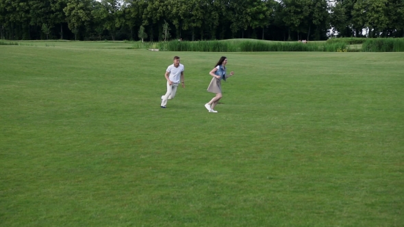 Young Guy Catches The Girl On The Nature, Stock Footage | VideoHive
