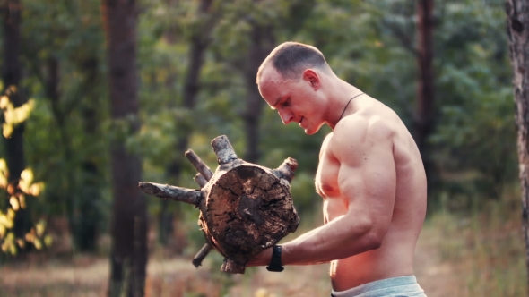 Muscular Man Lifting a Heavy Log, Stock Footage | VideoHive