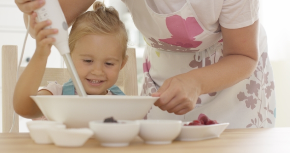 Cute Happy Little Girl Helping With The Baking, Stock Footage | VideoHive